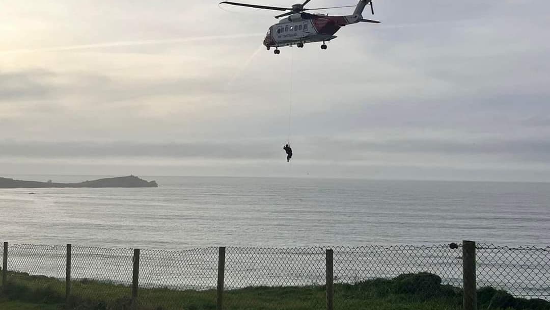 Two people airlifted to safety after being cut off by tide in Newquay ...