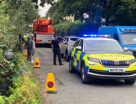 Work begins to free haulage truck stuck in narrow lane at Forder in ...
